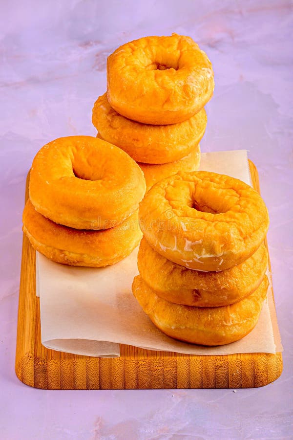 Golden Donuts on a Wooden Board. Stock Photo - Image of kitchen, sweet ...