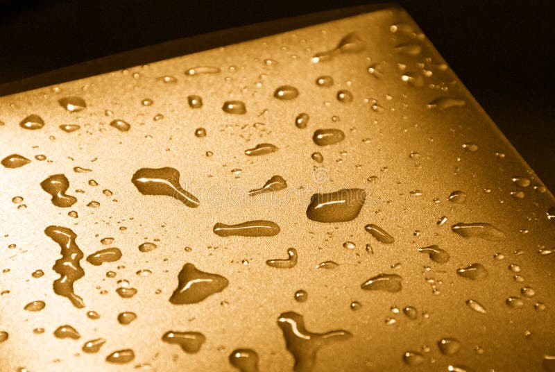 Golden Amber Water Drops stock image. Image of drink, shape - 4683827