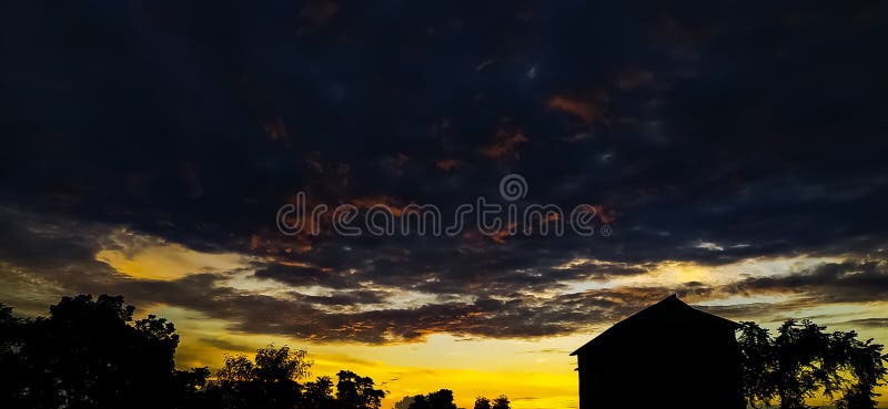 Golden Dusky Sky with Cloudy Sky Also Natural View Stock Photo - Image ...