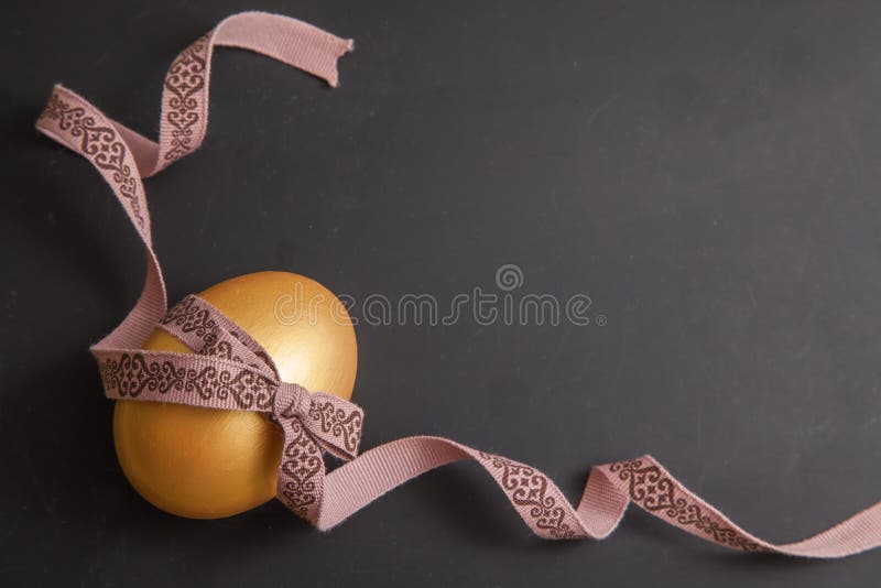 Golden Easter Egg with Ribbon Stock Photo - Image of food, isolated ...