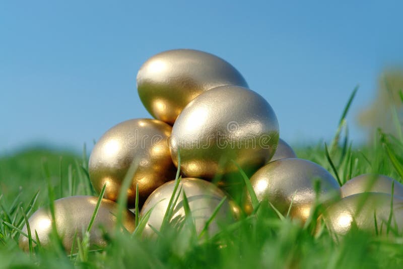 Golden egg pyramid stock photo. Image of grass, precious - 5005602