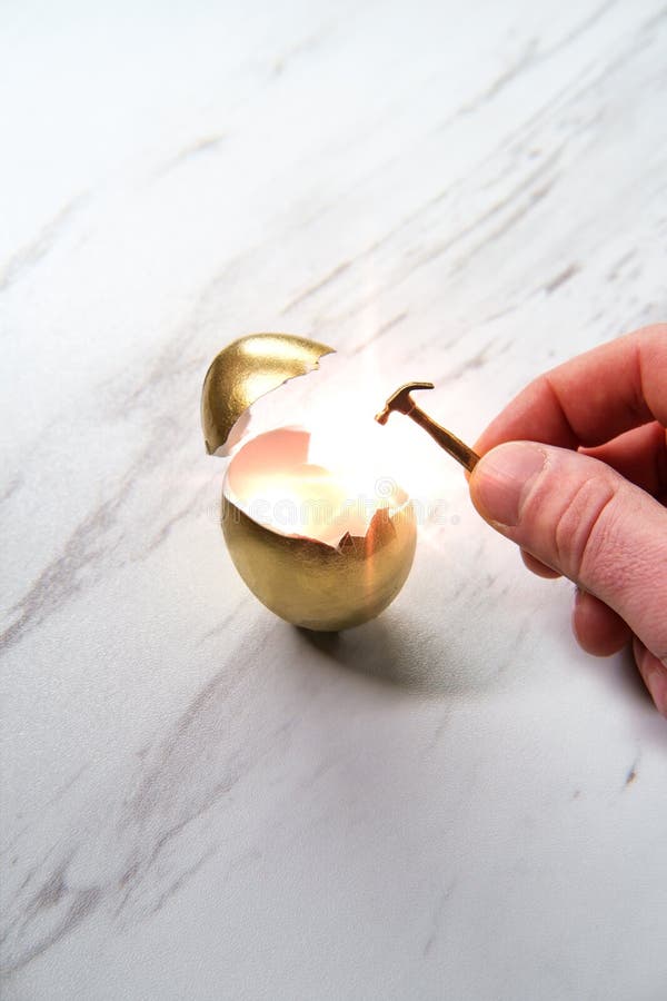Golden Egg Smash Hammer stock image. Image of easter - 134832661