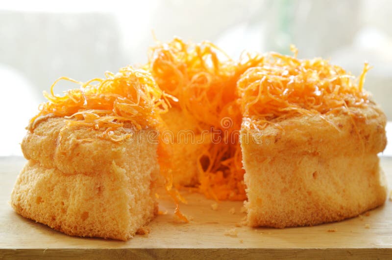 Golden Egg Threads Cake Cut for Piece on Chop Block Stock Photo - Image ...