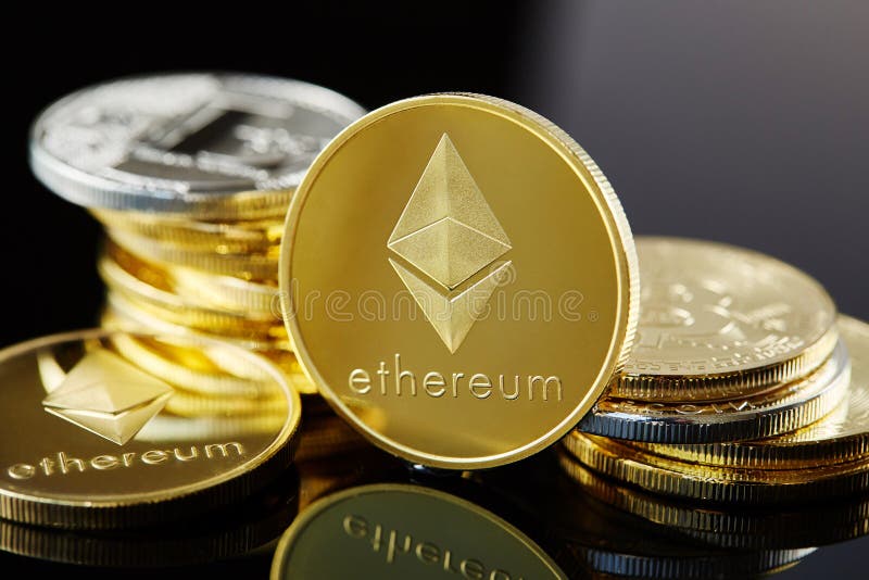 Golden Ethereum Coin Cryptocurrency on a Computer Mainboard, Selective ...