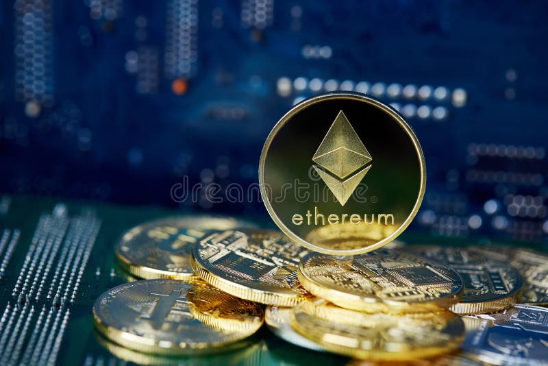 Golden Ethereum Coin Cryptocurrency on a Computer Mainboard, Selective ...