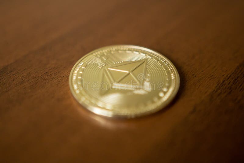 Golden Etherium Coin Close Up. Ether is a Cryptocurrency Whose ...