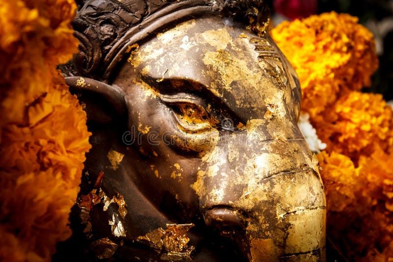 Golden face ganesha statue stock photo. Image of hinduism - 35532760