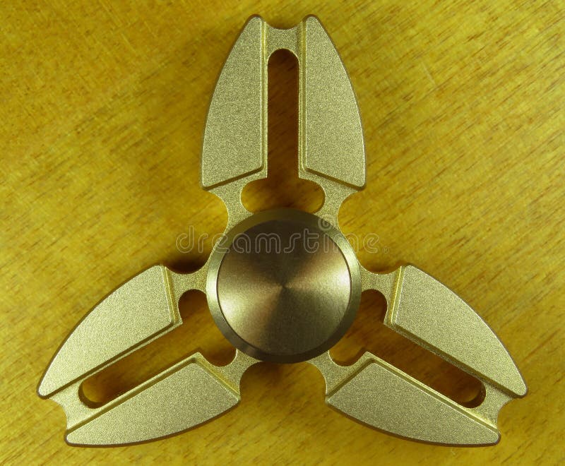 Golden fidget spinner toy stock image. Image of game - 93277981