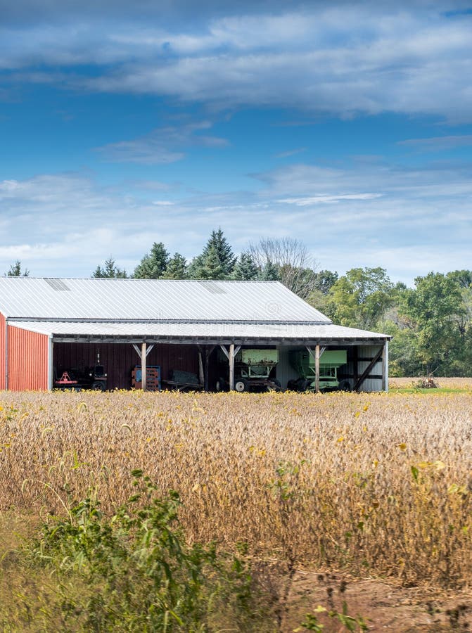 Golden Field with a Red Barn and Farm Tools Stock Photo - Image of fall ...