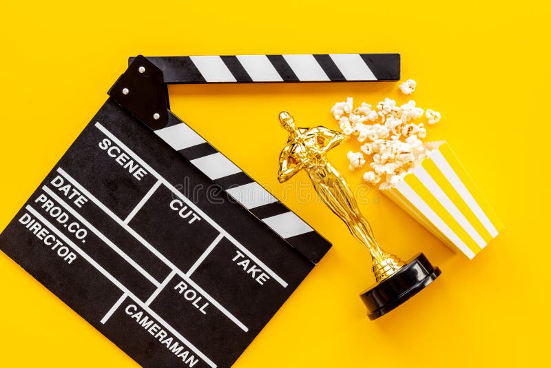 Golden Film Award Statue with Clapper Board and Popcorn Stock Photo ...