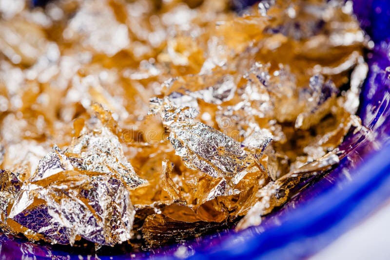 Golden Foil Metal Flakes on Blue Enamel Background Stock Photo - Image ...