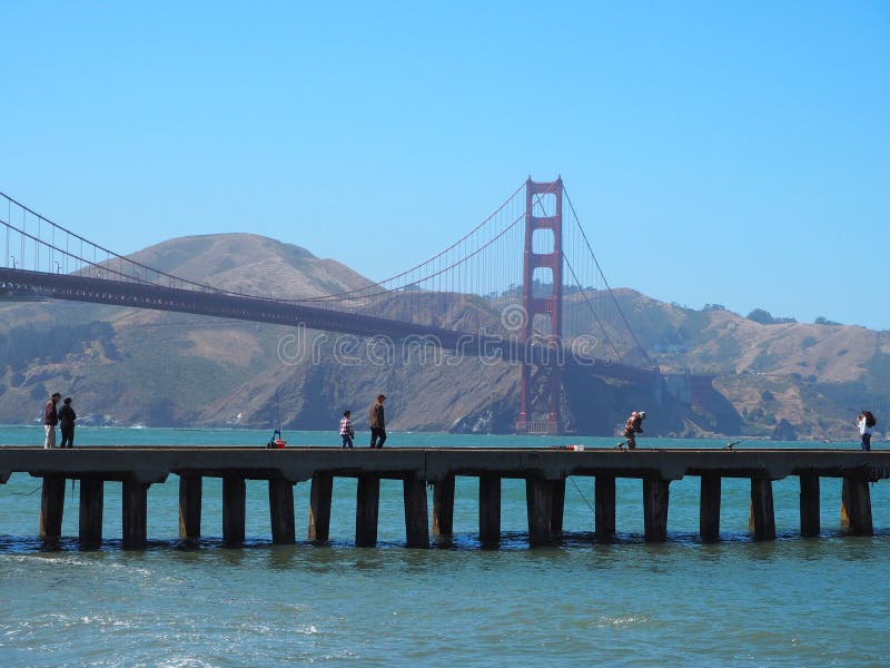 Golden Gate Bridge and People Walking Along a Jetty Editorial ...