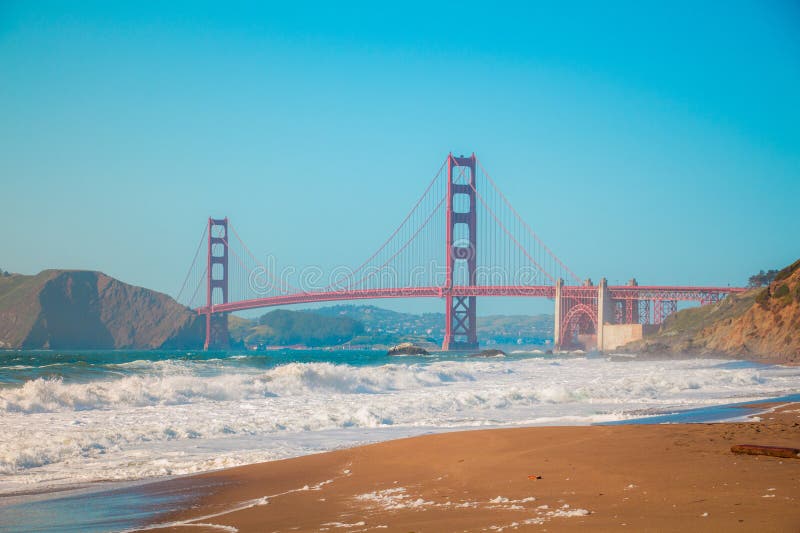 Golden Gate Bridge View from Baker Beach with Waves of the Ocean Waving ...
