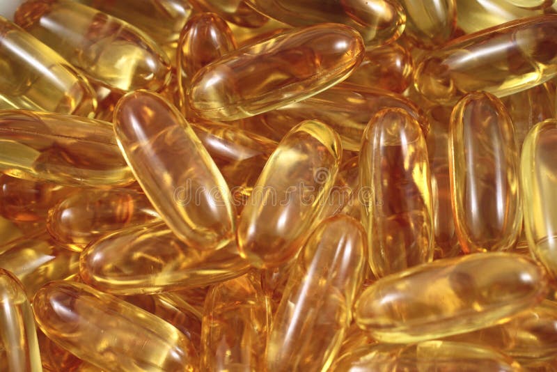 Golden gel capsule stock photo. Image of care, capsules - 93778136