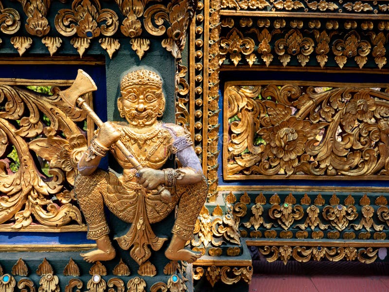 Golden Giant Statue Holding a Axe Sitting Stock Image - Image of ...