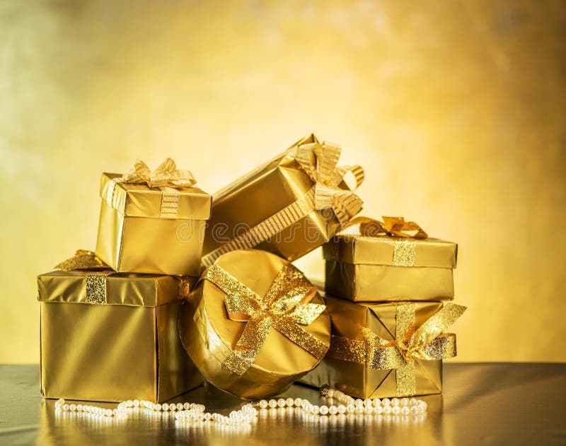Golden Gift Boxes As a Symbol of Wishes and Celebration. Golden Blurred ...