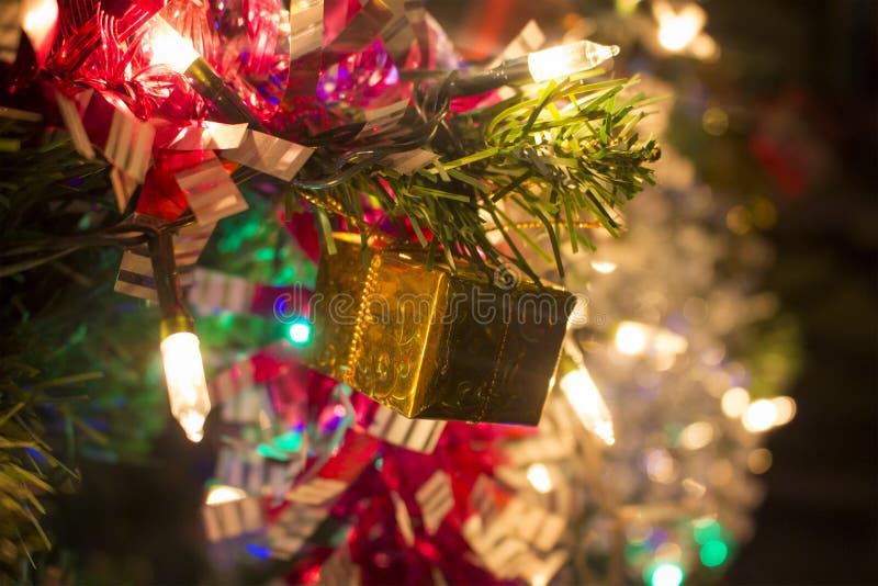 Golden Gift at a Branch of New Year Tree Stock Image - Image of gift ...