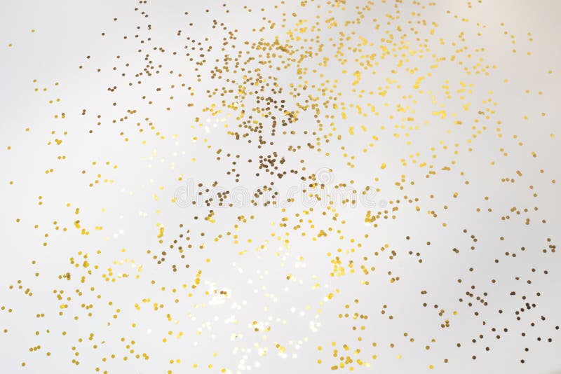 Golden Glitter Confetti On White Background Shiny Particles