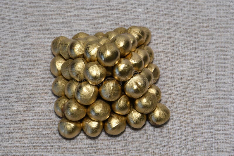 Golden Hazelnuts Stacked in a Pyramid Stock Photo - Image of shape ...