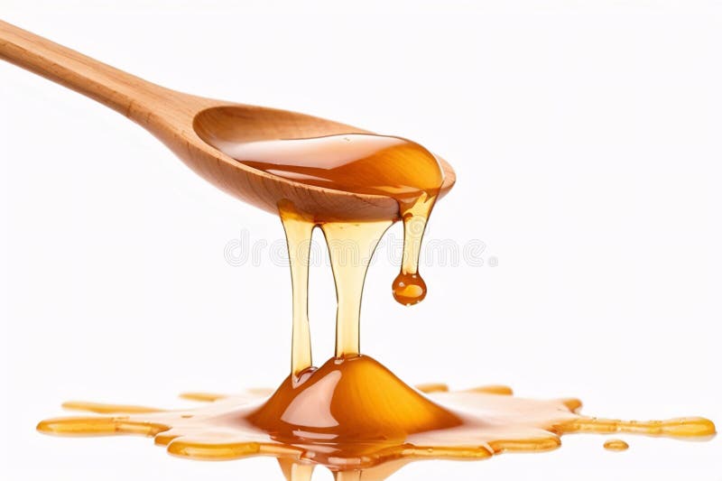 Golden Honey Dripping from Wooden Spoon, Forming a Puddle Stock ...