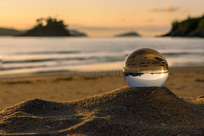 Sunset and Beach in a Crystal Ball Stock Photo - Image of golden ...