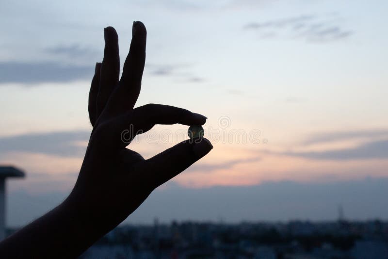 Golden Hour Hand with Goli in Hand Stock Image - Image of collection ...