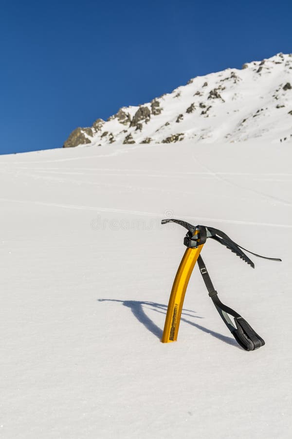 Golden ice axe loop. stock image. Image of winter, peak - 69946703