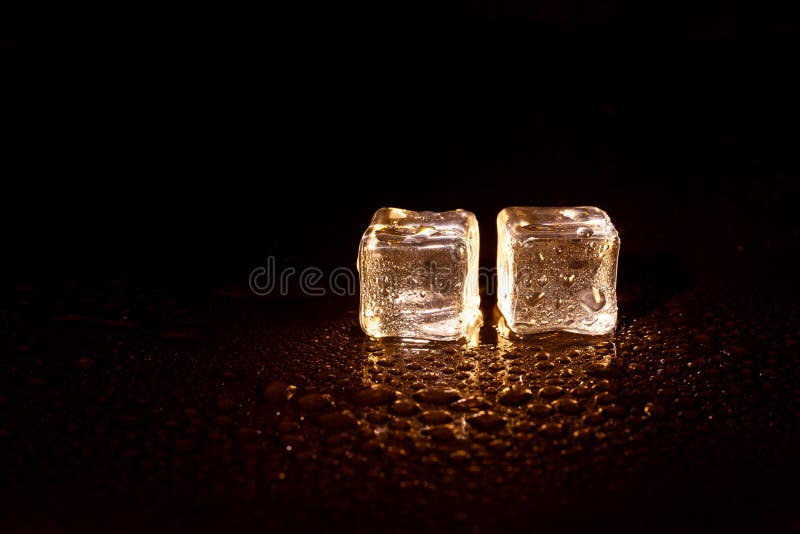 Golden Ice Cubes on Black Background Stock Photo - Image of closeup ...