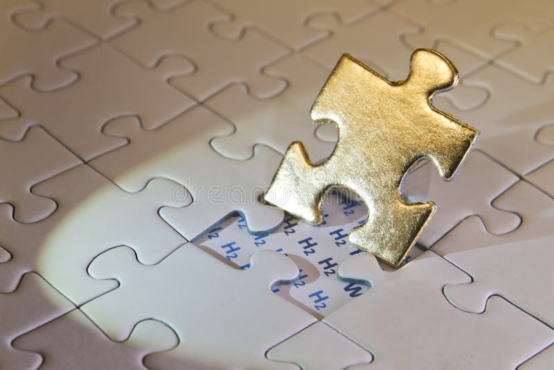 Golden Jigsaw Puzzle Piece Over H2 Written Under it Stock Photo - Image ...