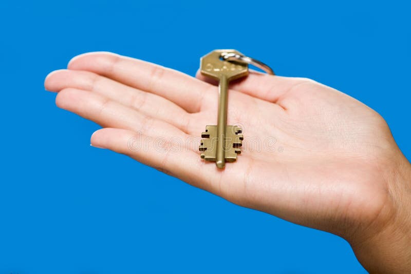 Business Man Offering a Golden Key in Open Palm Stock Image - Image of ...