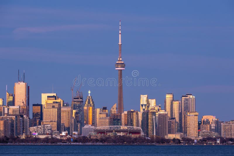 Golden Light Hitting the Toronto Skyline As the Sun Sets with a Blue ...