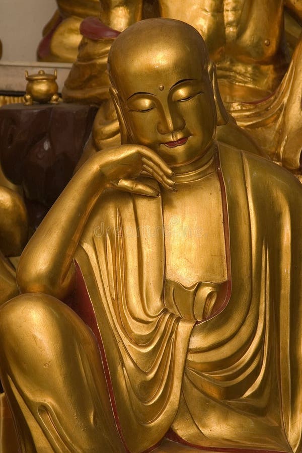 Golden Lohan statue stock photo. Image of golden, pray - 230256