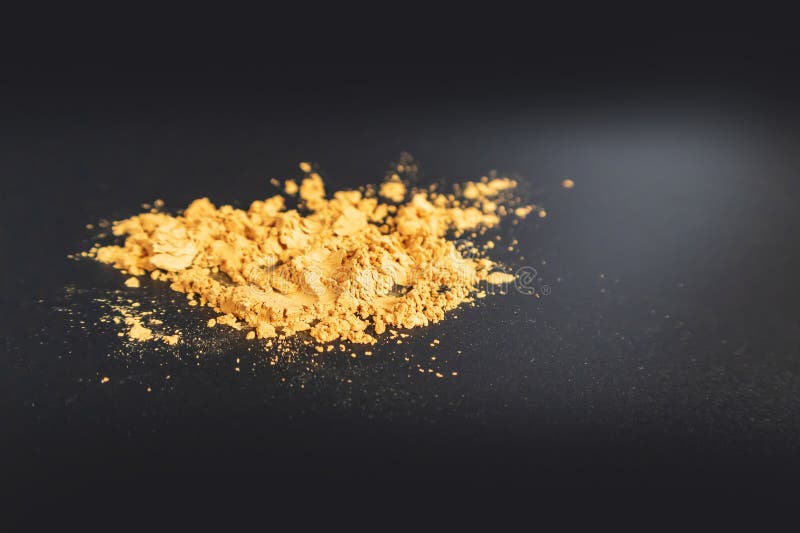Golden Loose Powder on a Black Background Stock Image - Image of ...