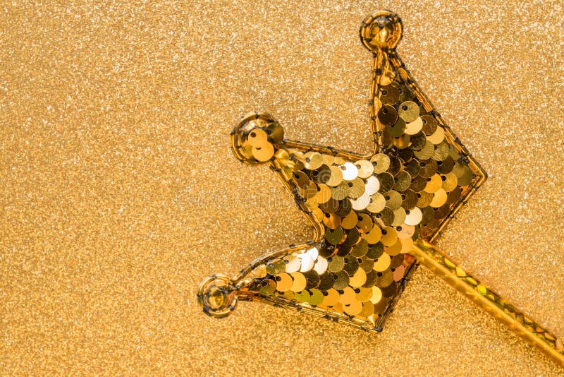 Golden Magic Stick from Sequins in Crown Shape on Golden Glitter ...