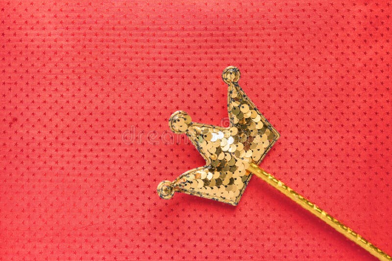 Golden Magic Stick from Sequins in Crown Shape on Red Background ...