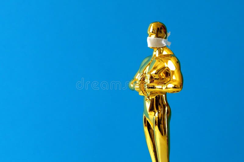 Hollywood Golden Oscar Academy Award Statue in Mask on Blue Background ...