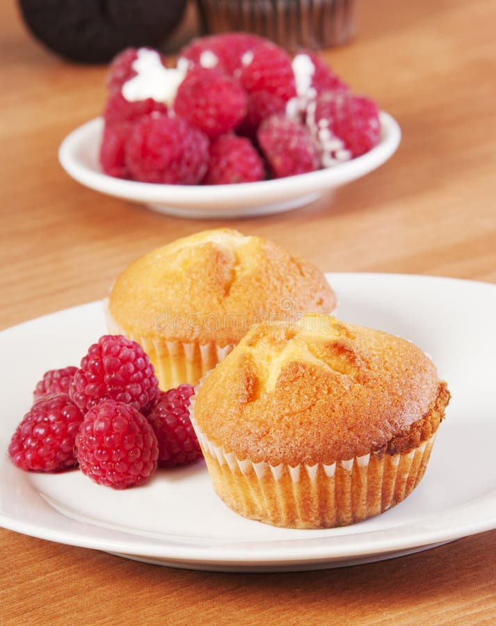 Golden Muffins with Raspberries Stock Image - Image of sweet, muffins ...