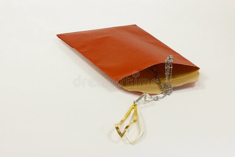 Golden Necklace and a Red Envelope Stock Photo - Image of pendant ...