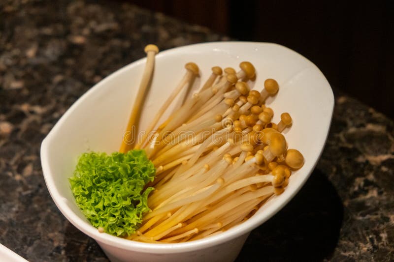 Golden Needle Mushroom stock photo. Image of bowl, nature - 351183176
