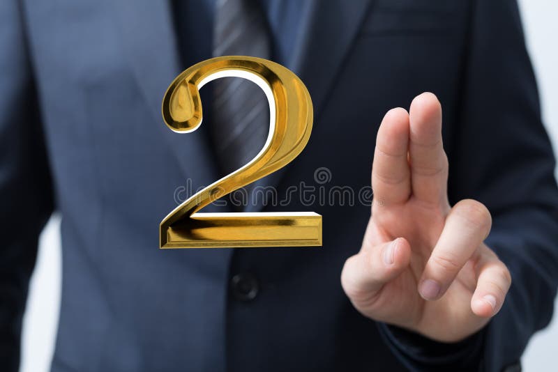Golden Number 2 Over Someone S Hand Stock Photo - Image of hand ...