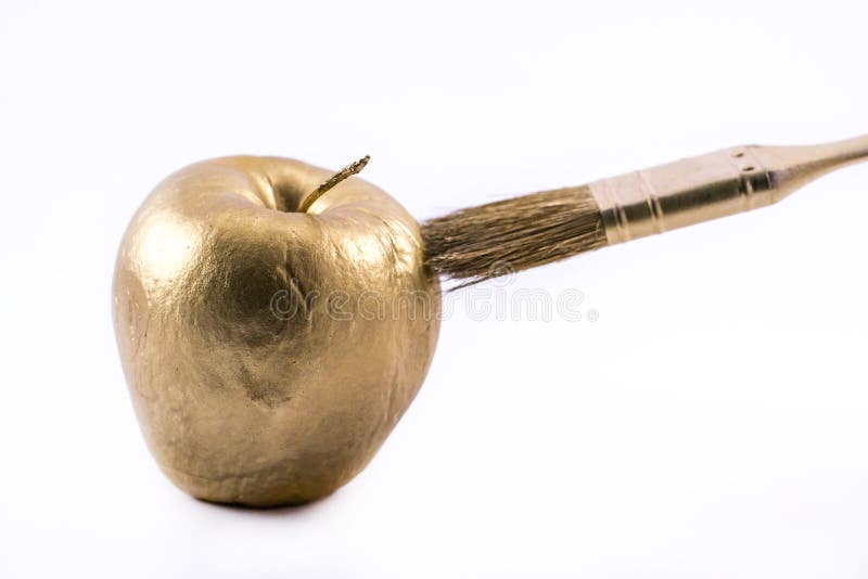 Golden Painted Apple with a Brush on a White Background Stock Image ...