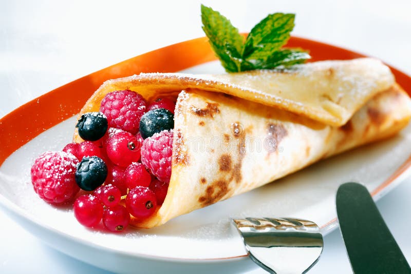 Golden Pancake Filled with Berries Stock Photo - Image of closeup ...