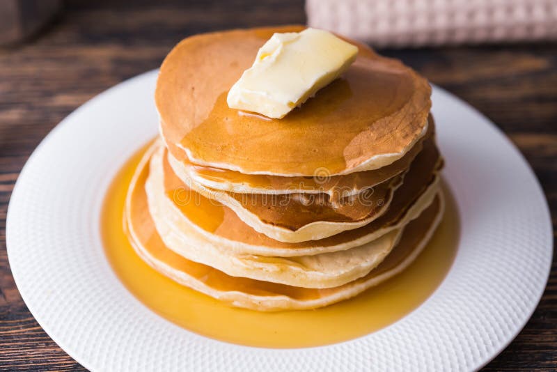Golden Pancakes with Butter and Warm Maple Syrup. Stock Photo - Image ...