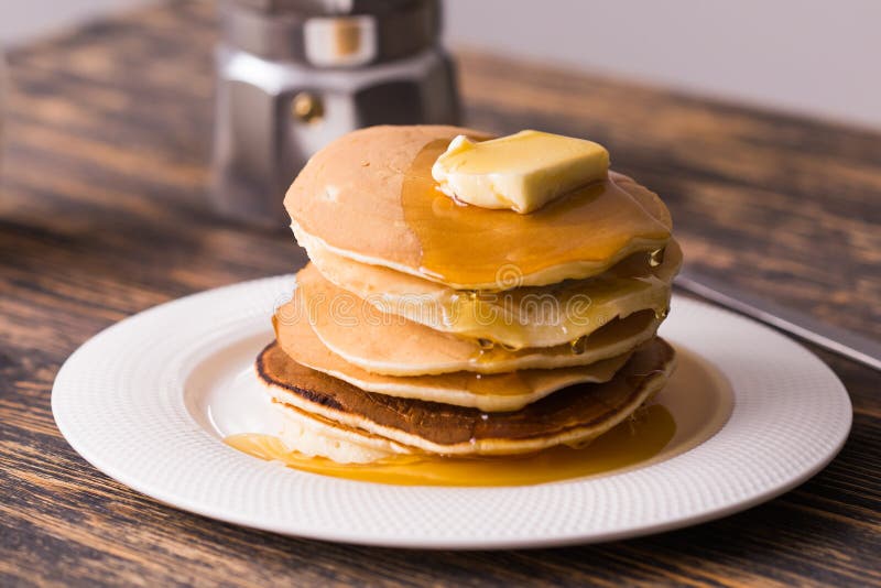 Golden Pancakes with Butter and Warm Maple Syrup. Stock Photo - Image ...