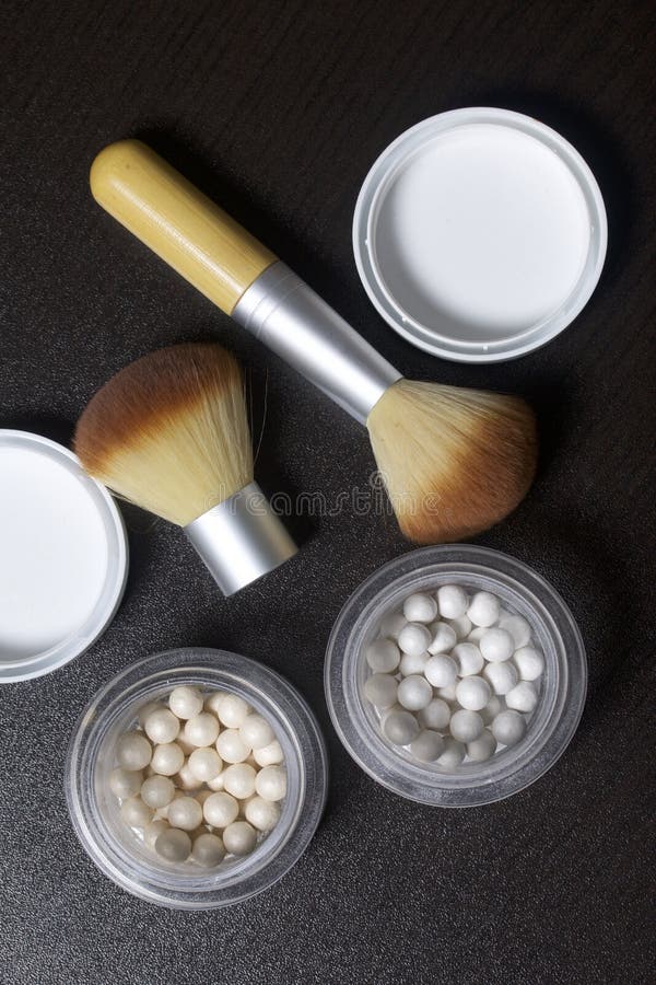 Golden and Pearl Highlighter in the Form of Balls in an Open Jar ...