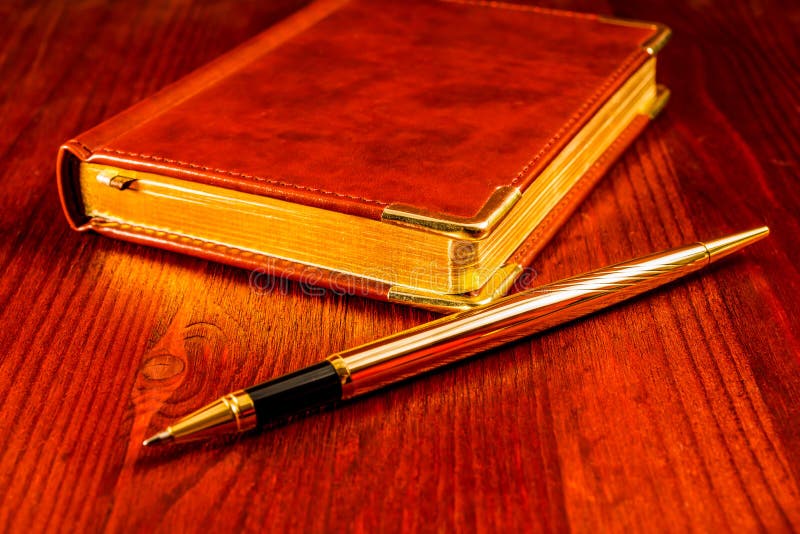 Golden Pen with a Leather Diary Stock Photo - Image of ideas, business ...