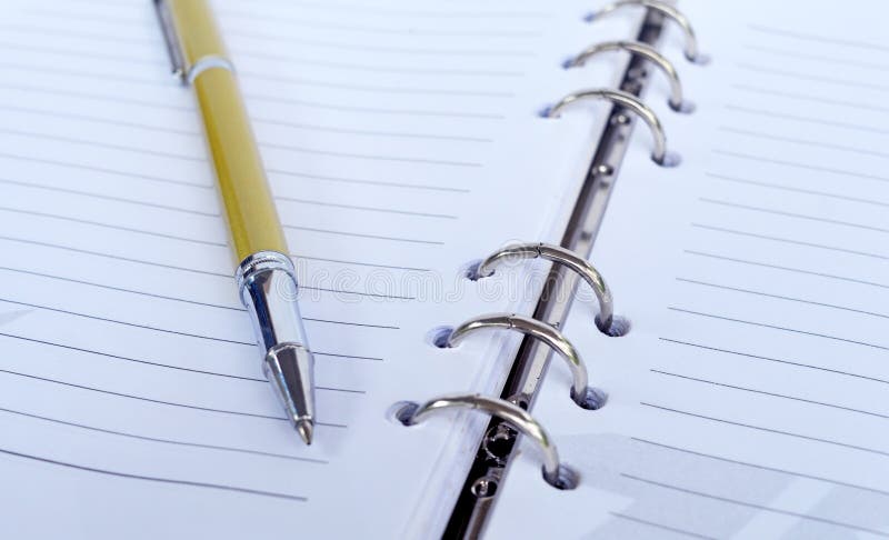 Golden Pen on note pad stock photo. Image of list, blank - 93844124