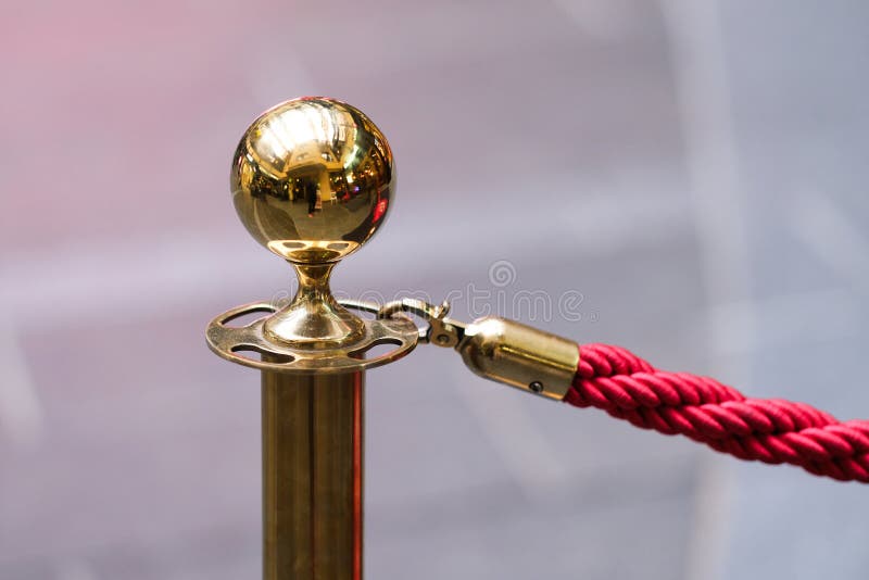 Golden pole rope barrier stock photo. Image of barrier - 345854540