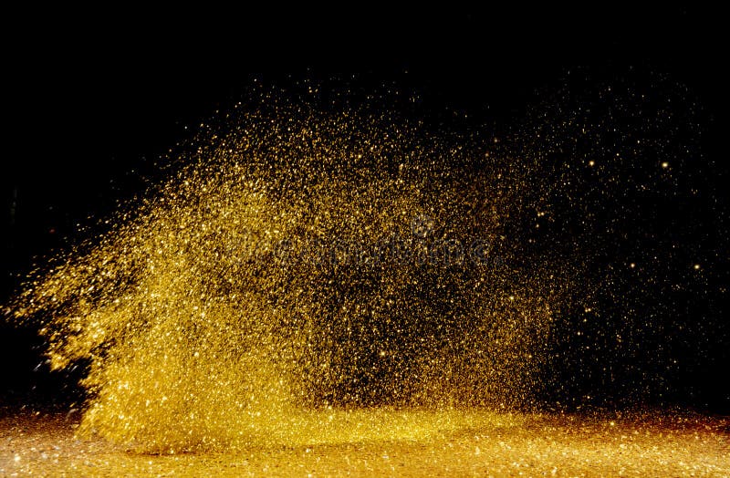 Golden Powder Scattered Over the Dark Background Stock Image - Image of ...