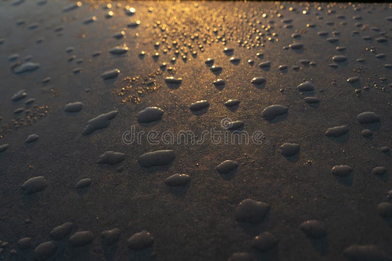 Golden Raindrops with Multiple Reflections Stock Photo - Image of ...